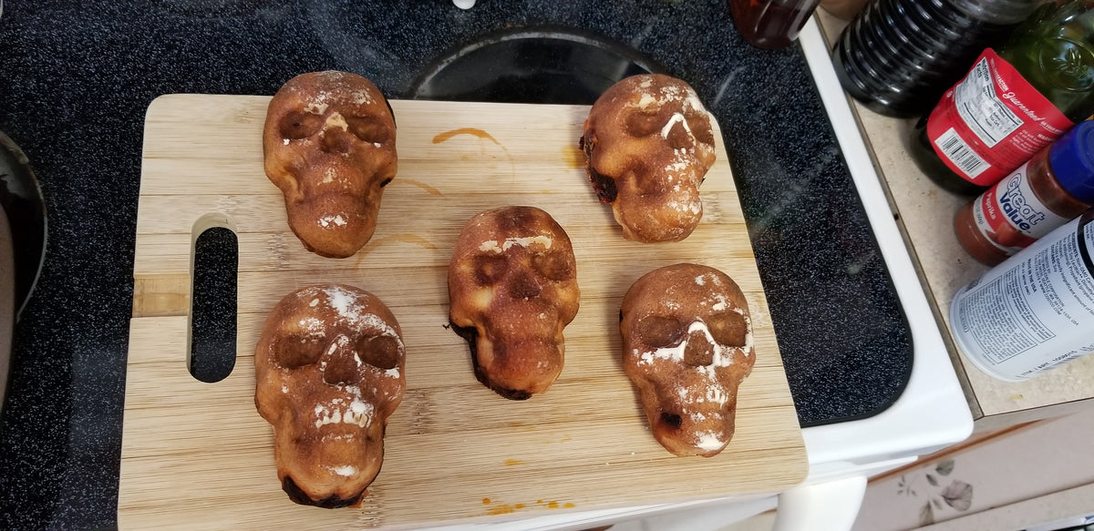 Five Skull shaped Pizzas on a cutting board Free Stock image – Dark ...